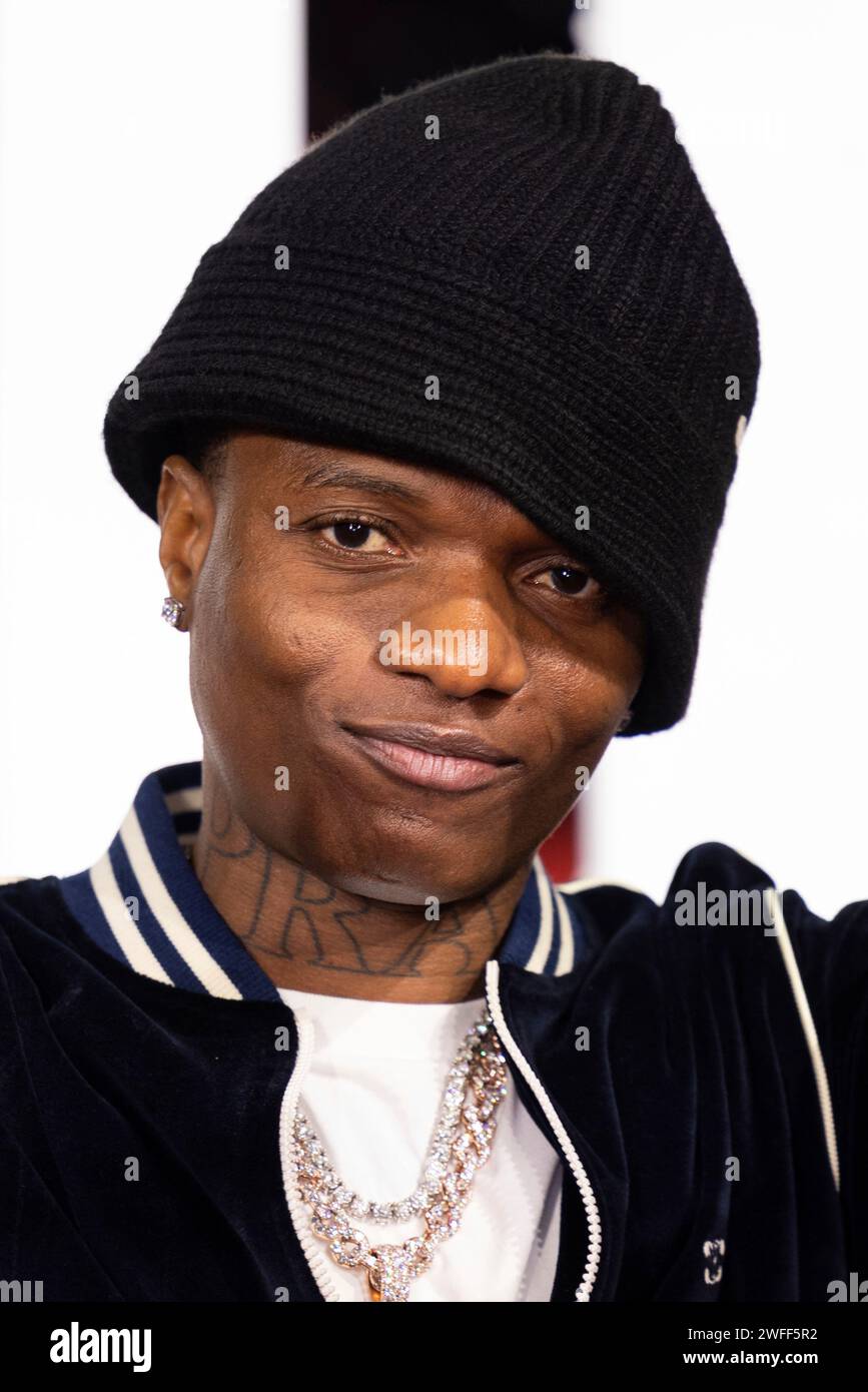 Ayodeji Ibrahim Balogun, known professionally as Wizkid, poses for photographers upon arrival at ...