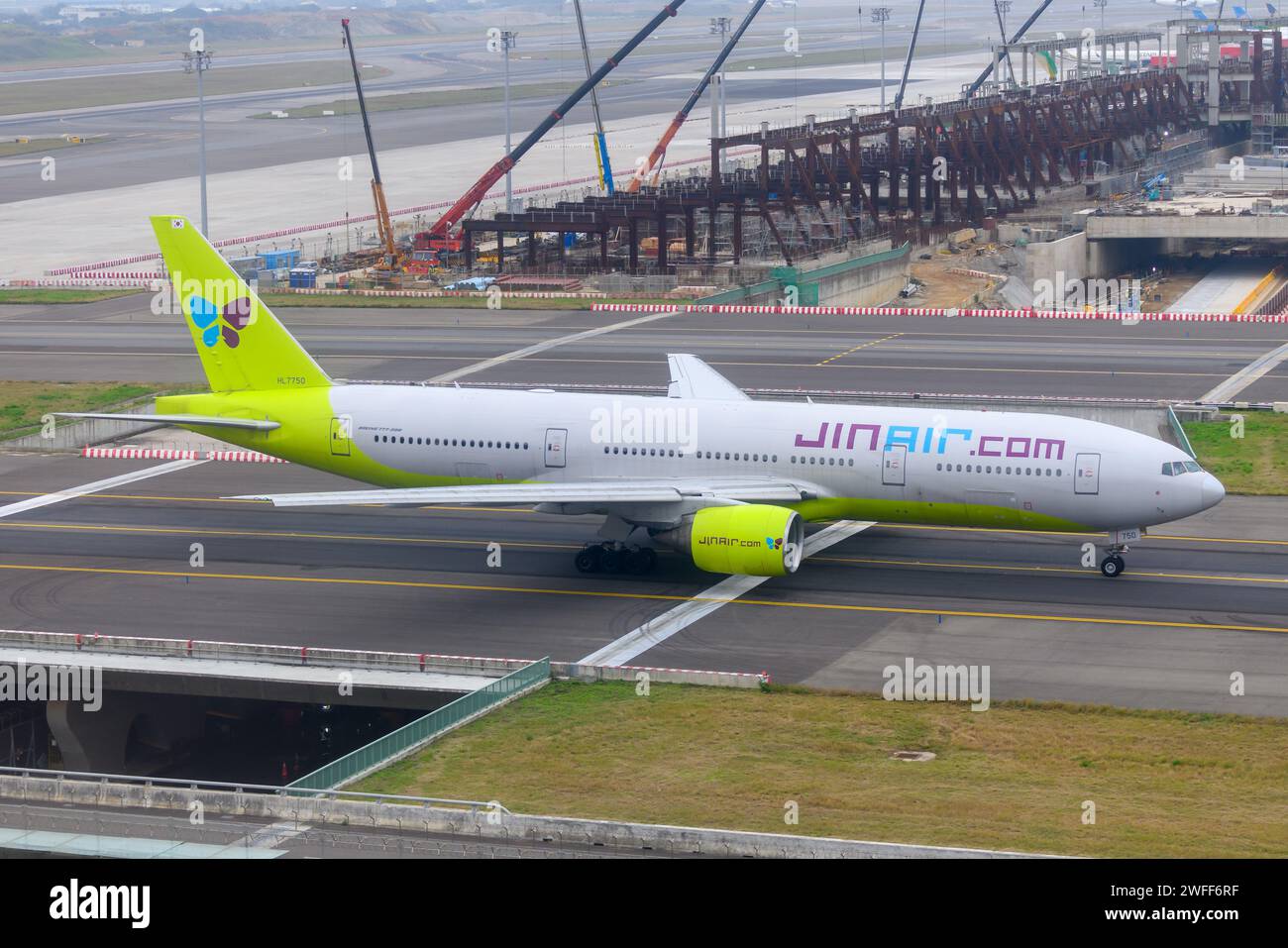 Jin Air Boeing 777 aircraft taxiing. Airplane B777 of JinAir airline ...