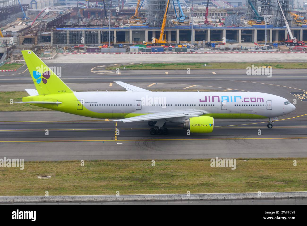 Jin Air Boeing 777 airplane taxiing. Aircraft B777 of JinAir airline ...