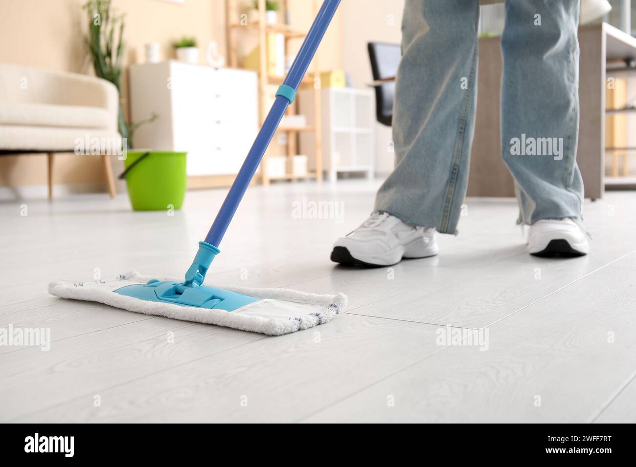 Housewife mopping floor in living hi-res stock photography and images ...