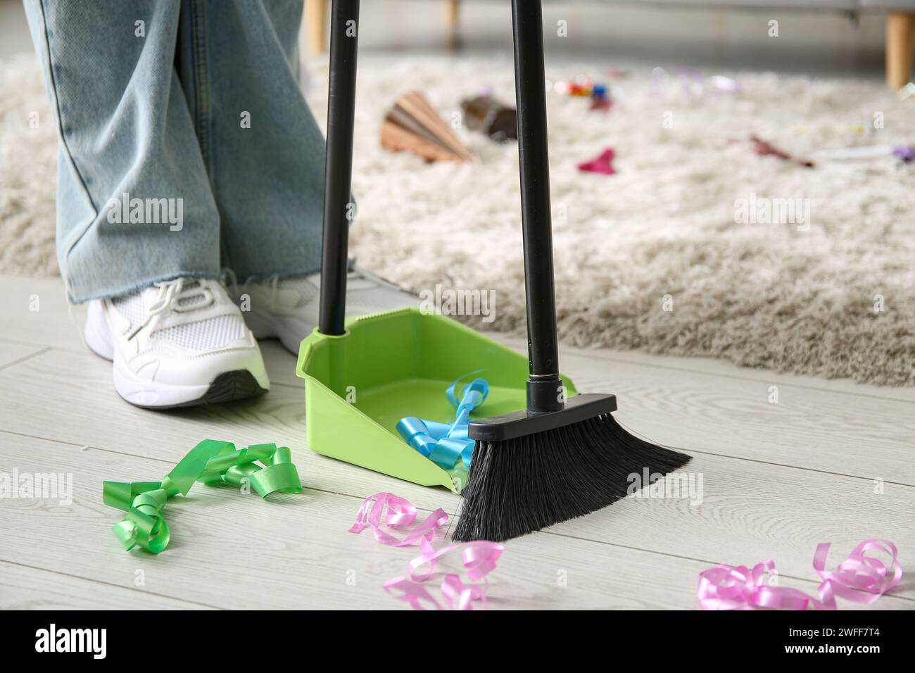 Woman cleaning living room after party, closeup Stock Photo - Alamy