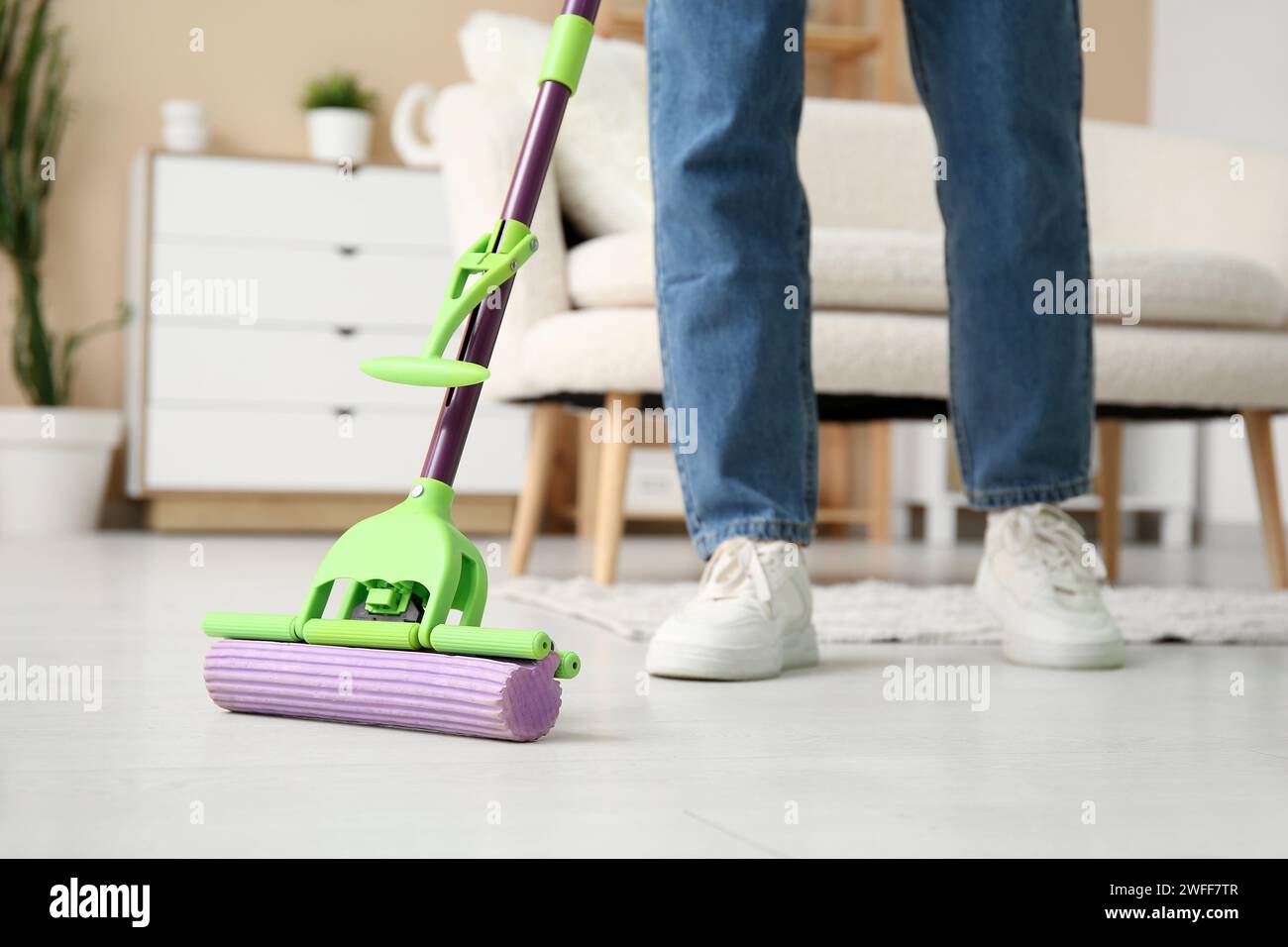 Housewife mopping floor in living hi-res stock photography and images ...