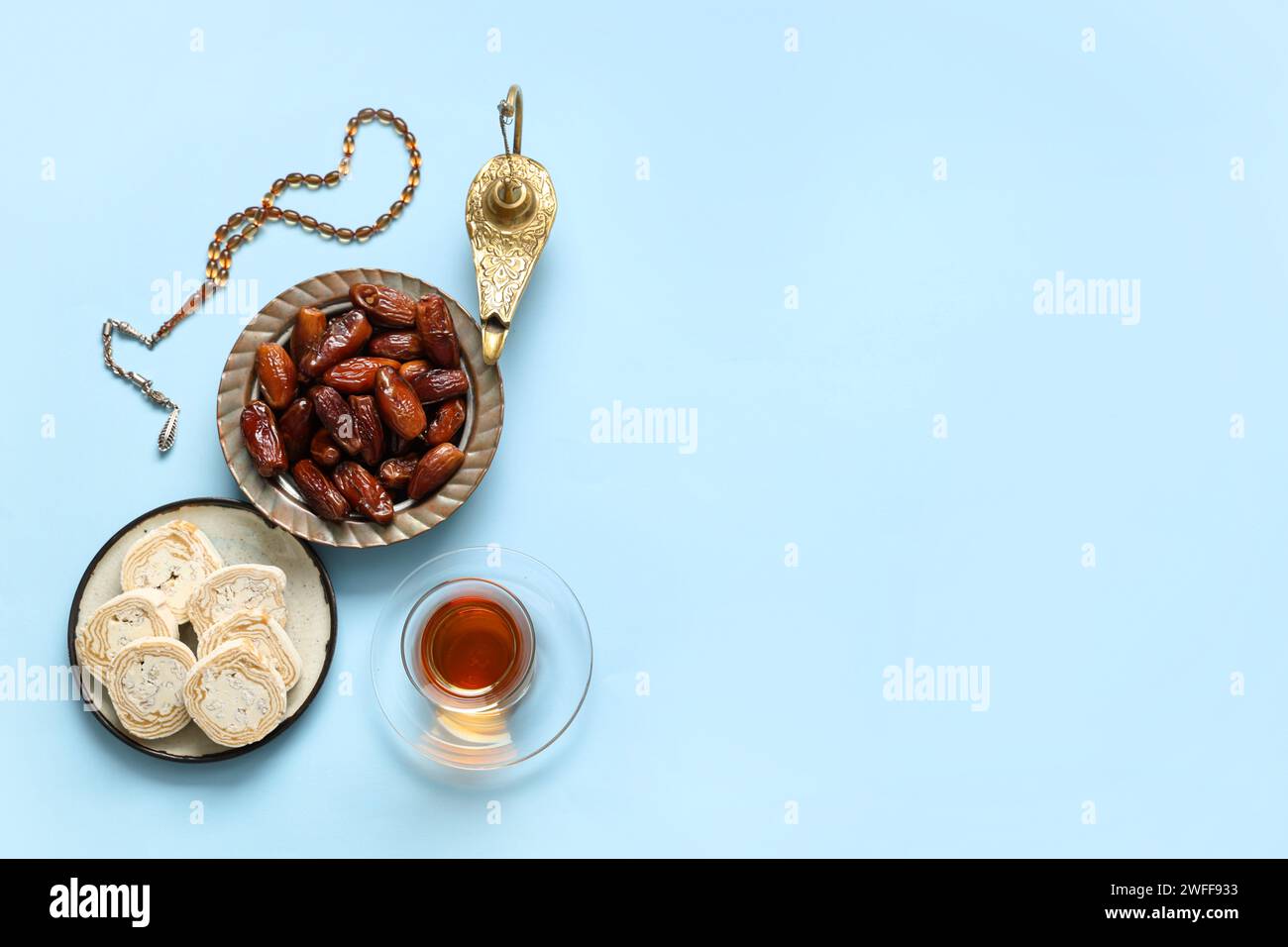Composition with traditional Eastern sweets, Aladdin lamp and tasbih ...