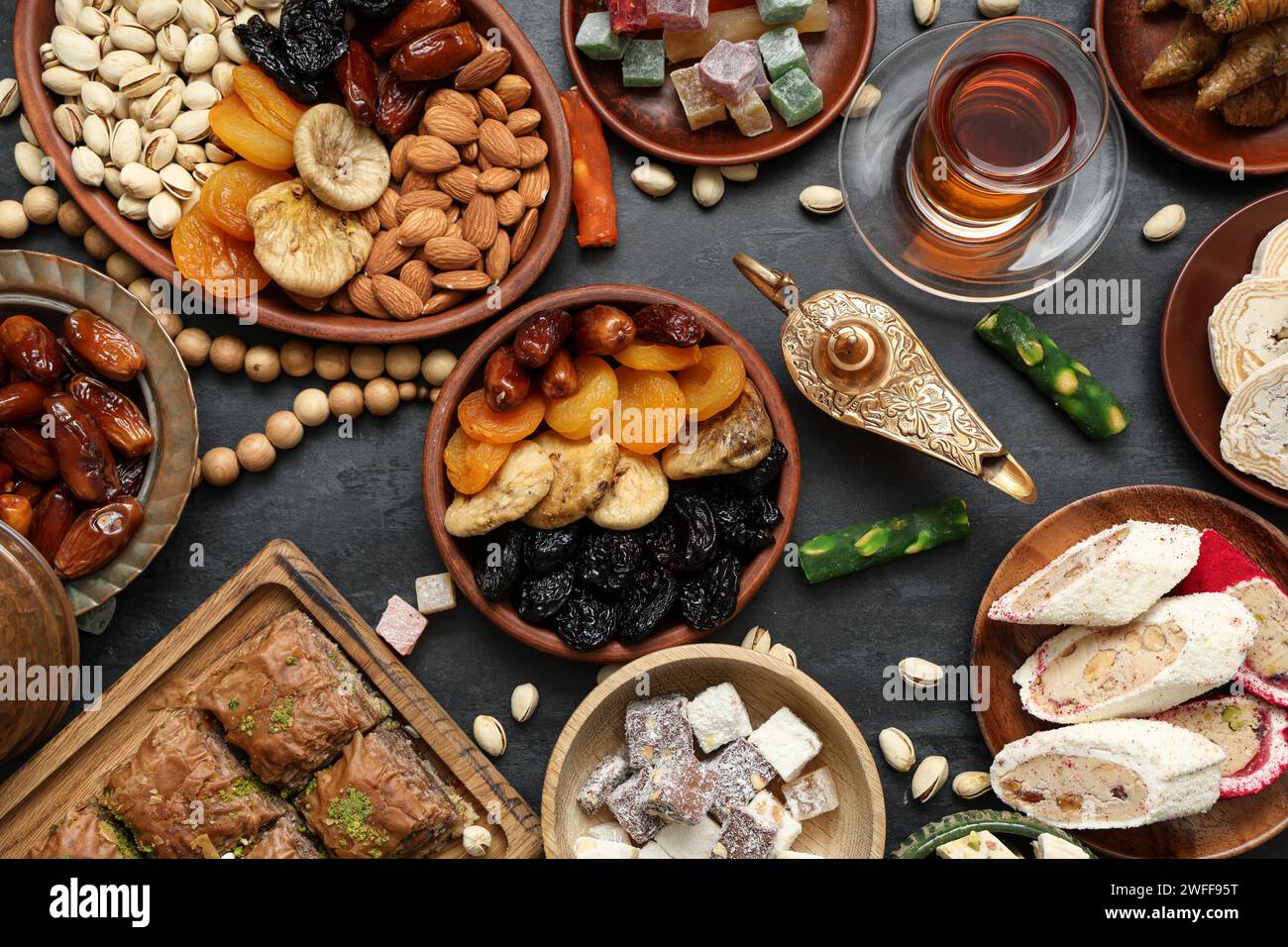 Composition with traditional Eastern sweets, Aladdin lamp and tasbih ...