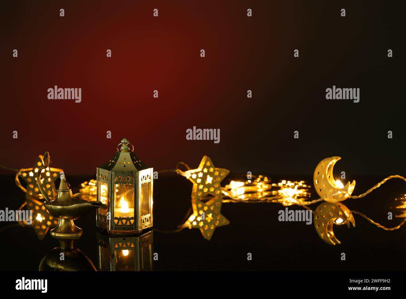 Muslim lantern with burning candle, garland and Aladdin lamp for ...