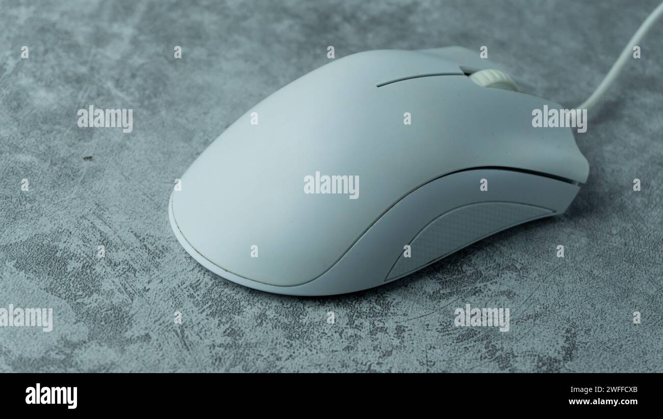 White PC mouse on a gray background with concrete texture Stock Photo ...
