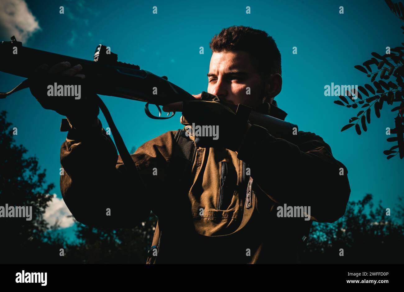 Hunting gun. Hunter aiming rifle in forest. Hunter with shotgun gun on ...