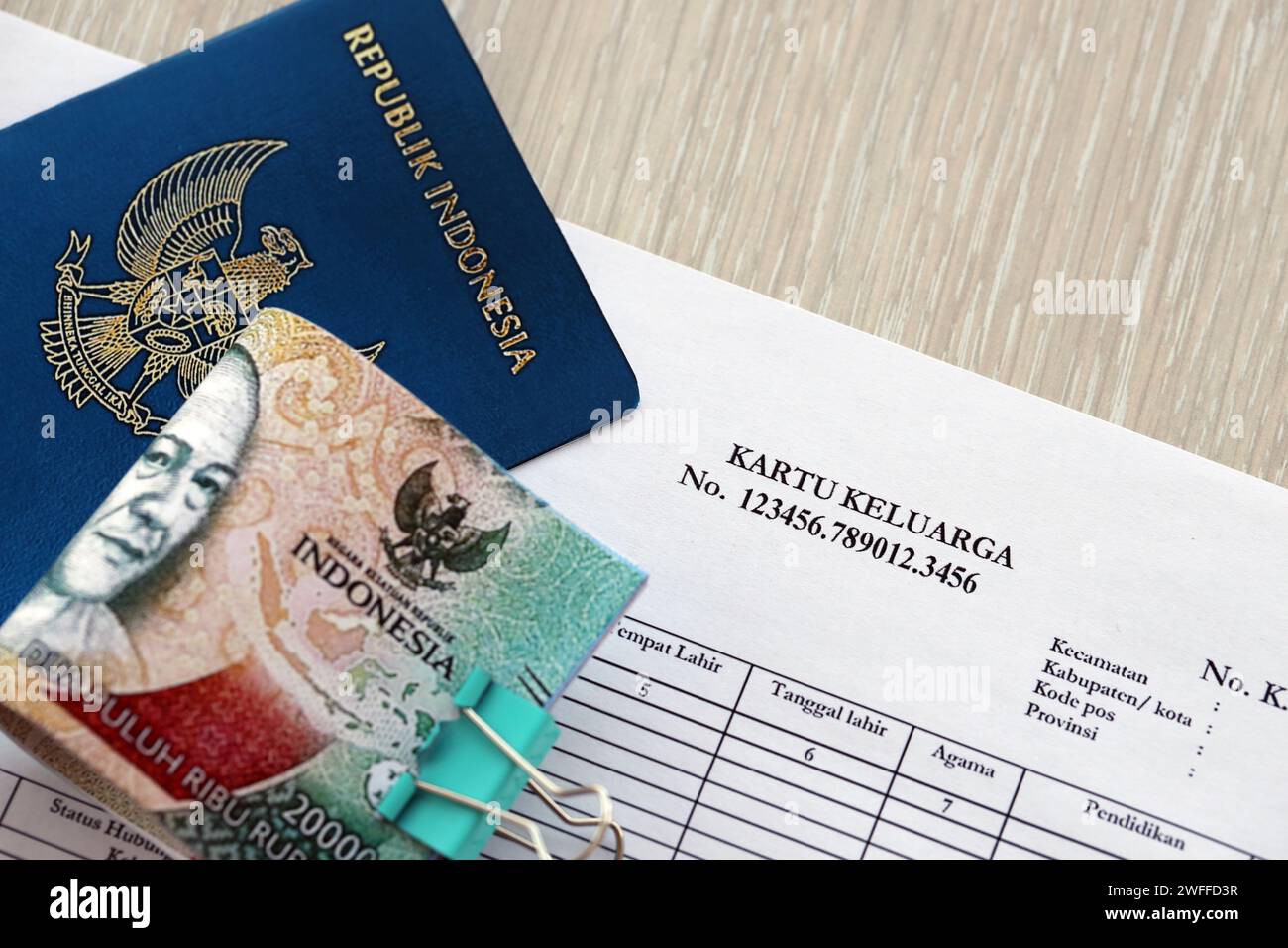 Kartu keluarga Family Identity Card with indonesian passport and bunch ...