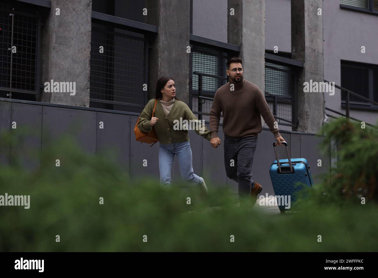 Being late couple suitcase hi-res stock photography and images - Alamy