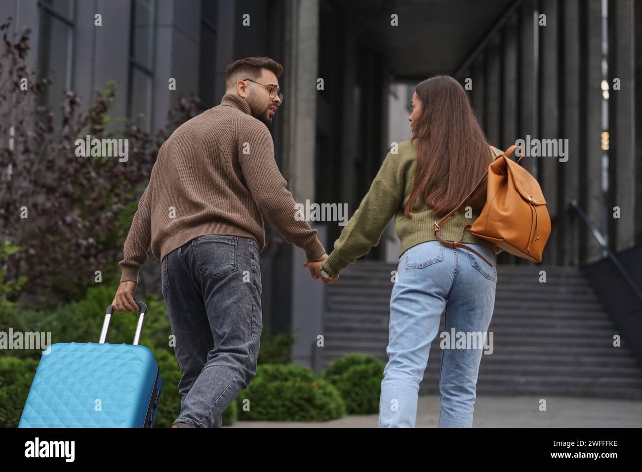 Being late couple suitcase hi-res stock photography and images - Alamy