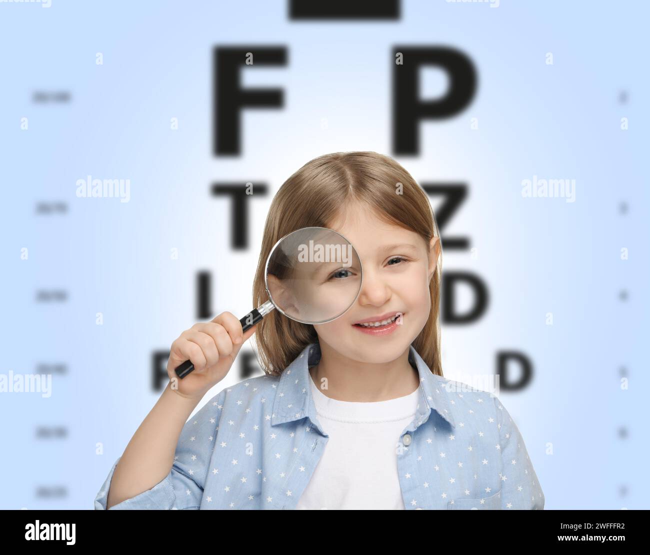 Vision test. Little girl with magnifying glass and eye chart on ...
