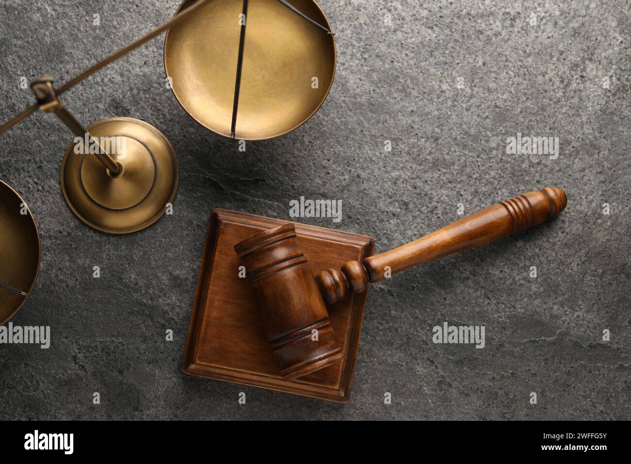 Law concept. Judge's mallet and scales of justice on dark grey table ...