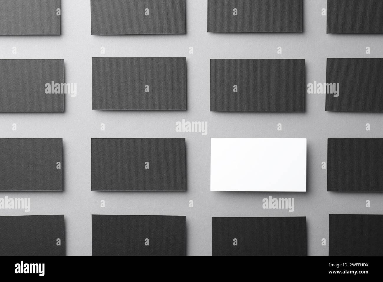 Blank business cards on light grey background, flat lay. Mockup for ...