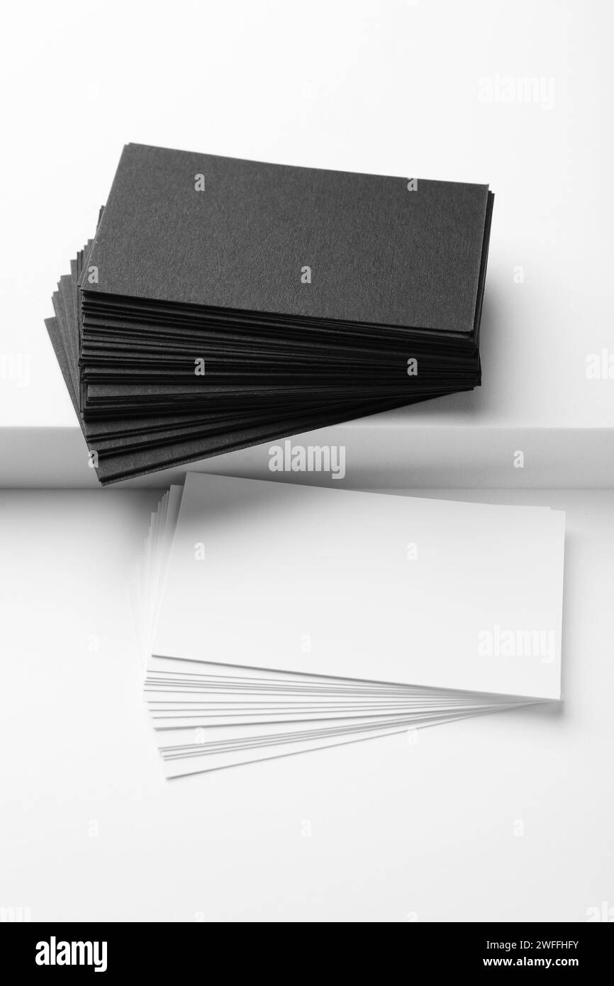 Business cards on white background. Mockup for design Stock Photo - Alamy