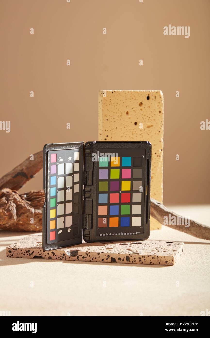 A color checker placed on a stone podium in rectangle shape, displayed ...