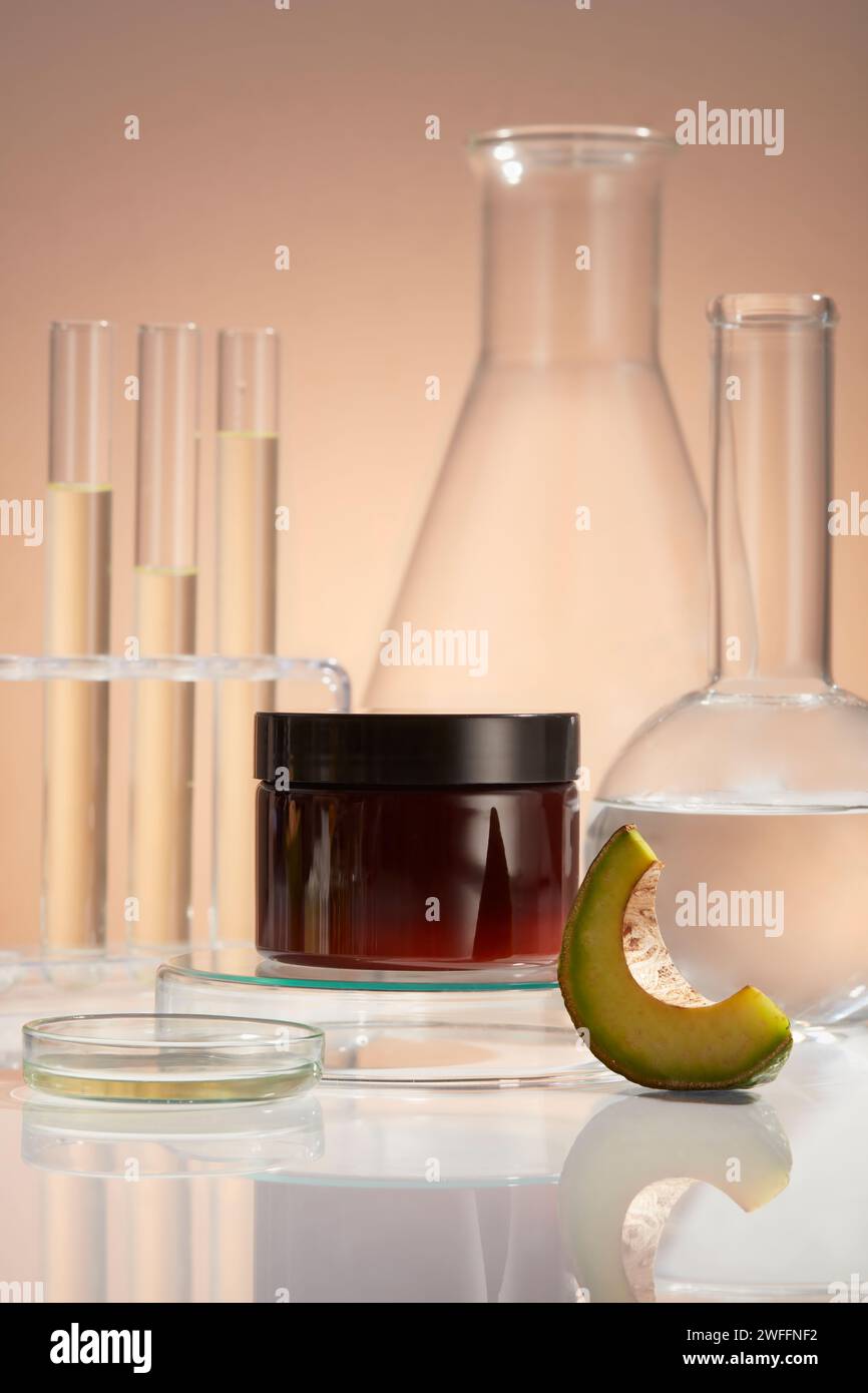 Empty label jar arranged with laboratory glassware and Avocado slice ...