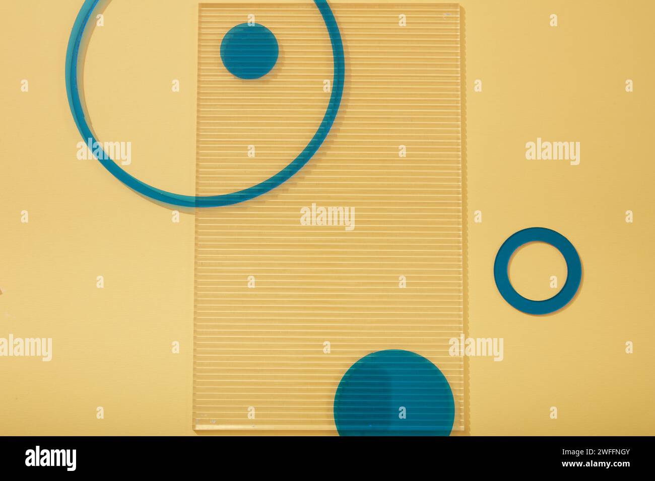 A ribbed acrylic sheet decorated with some blue round acrylic sheets ...