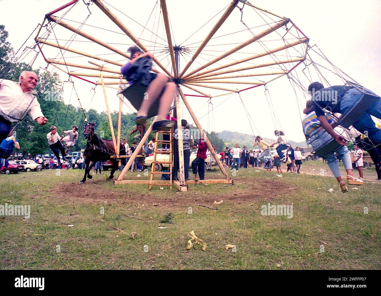 Vrancea County, Romania, approx. 1992. Local people enjoying a ride at ...