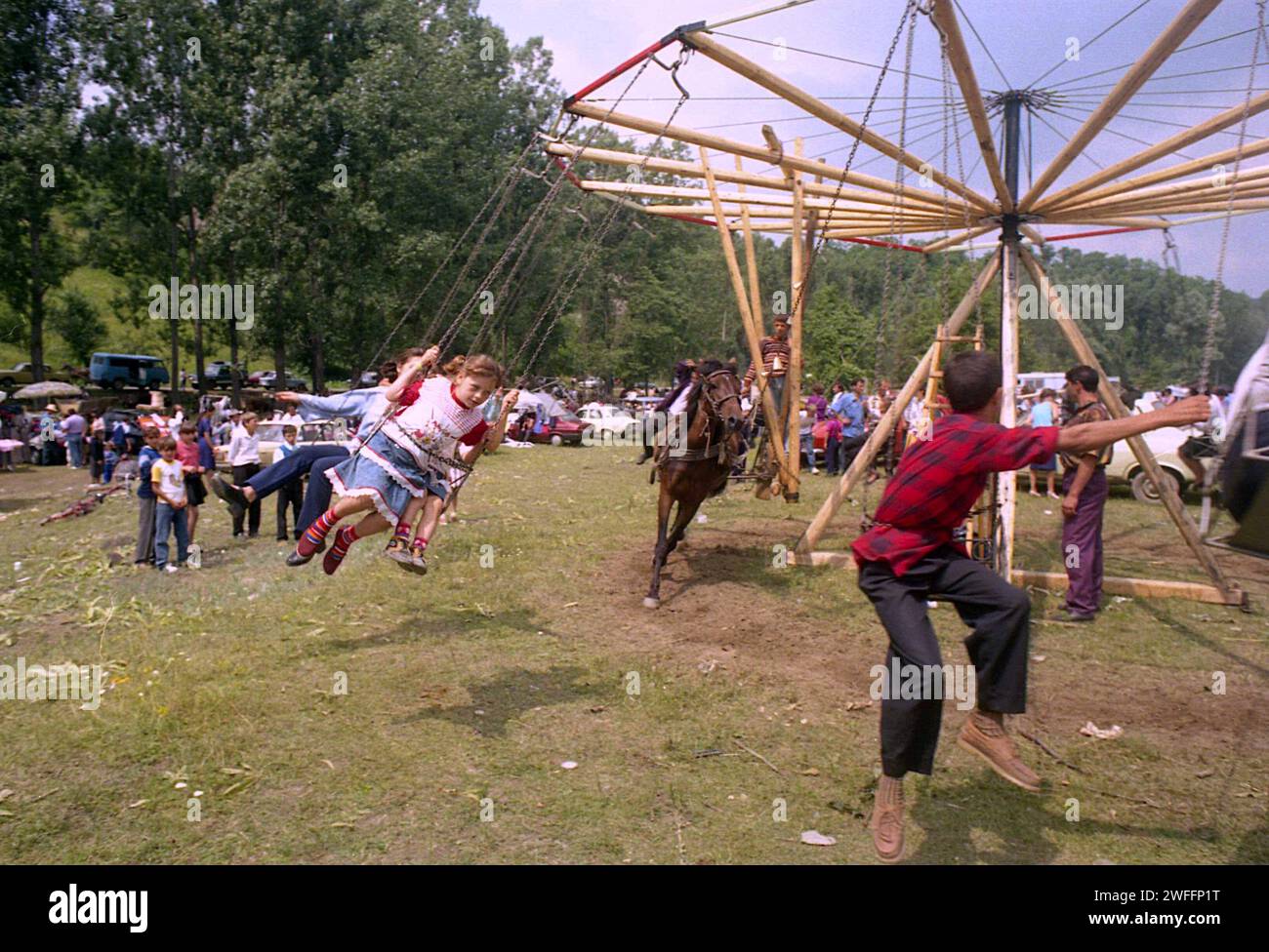 Vrancea County, Romania, approx. 1992. Local people enjoying a ride at ...