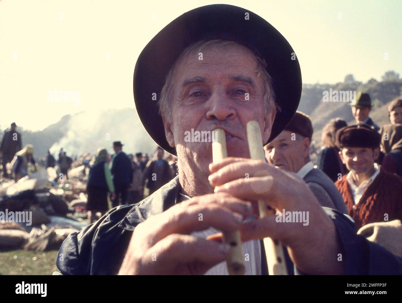 Old man playing flute in hi-res stock photography and images - Alamy