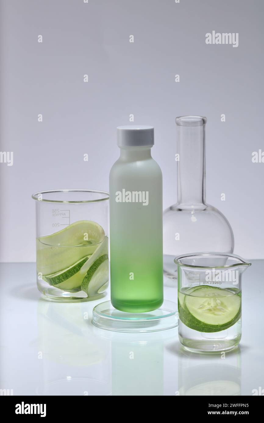 Against a white background, an unbranded bottle is decorated with ...