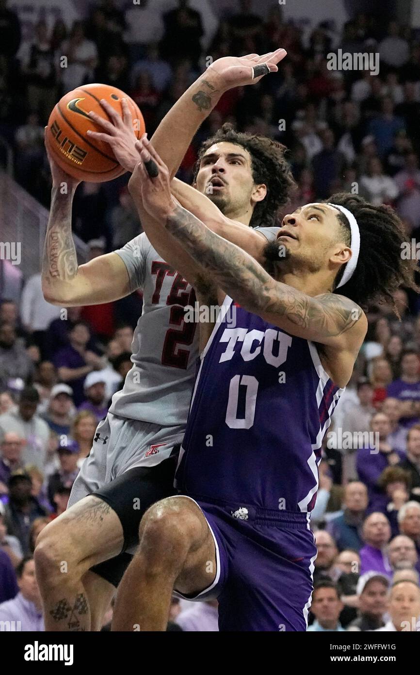 Texas Tech guard Pop Isaacs (2) leaps to the basket to take a shot as ...