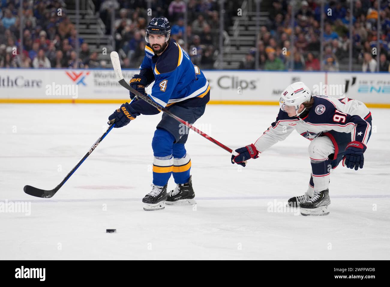 St. Louis Blues' Nick Leddy (4) and Columbus Blue Jackets' Kent Johnson ...
