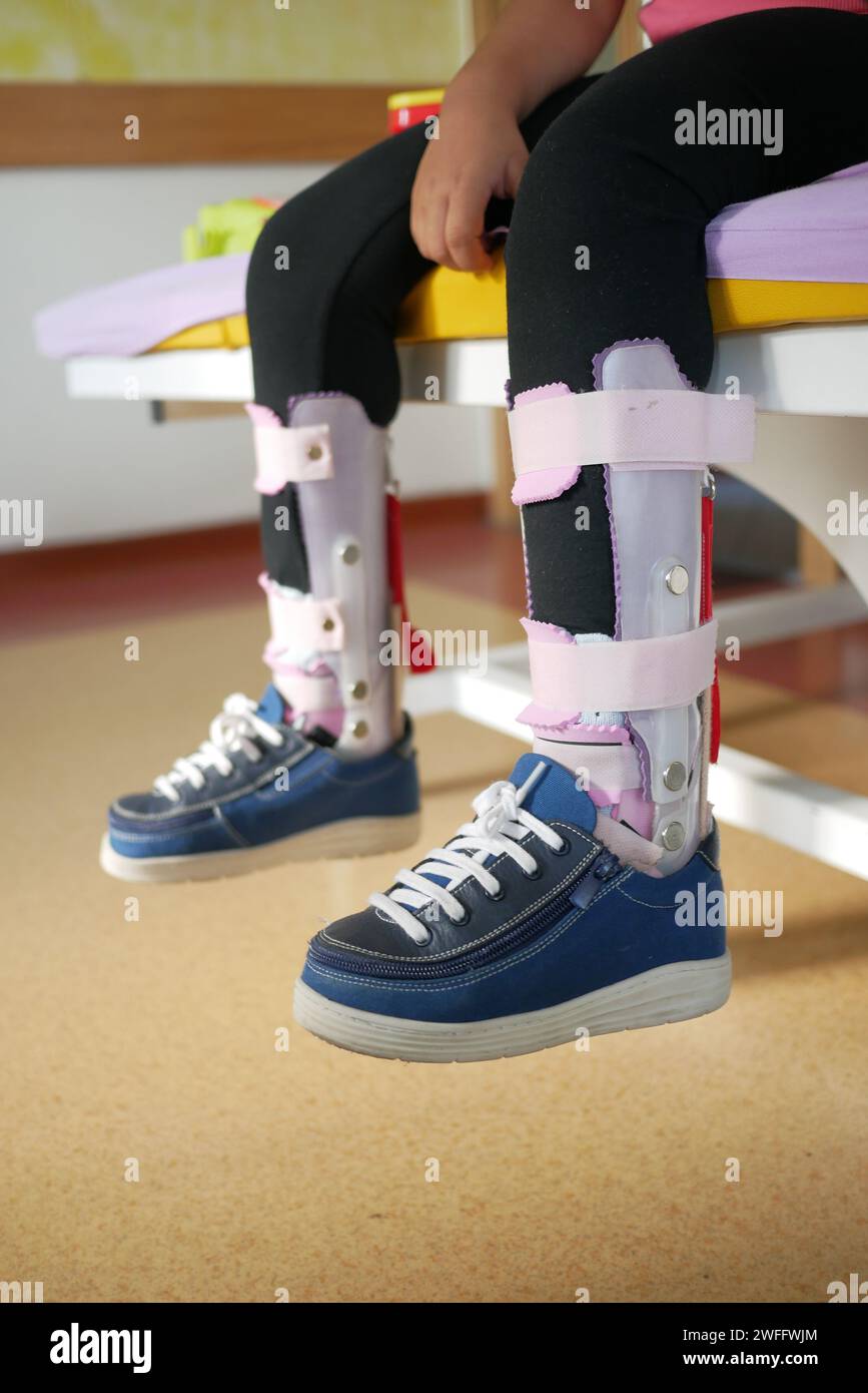 Child cerebral palsy disability, legs orthosis Stock Photo - Alamy