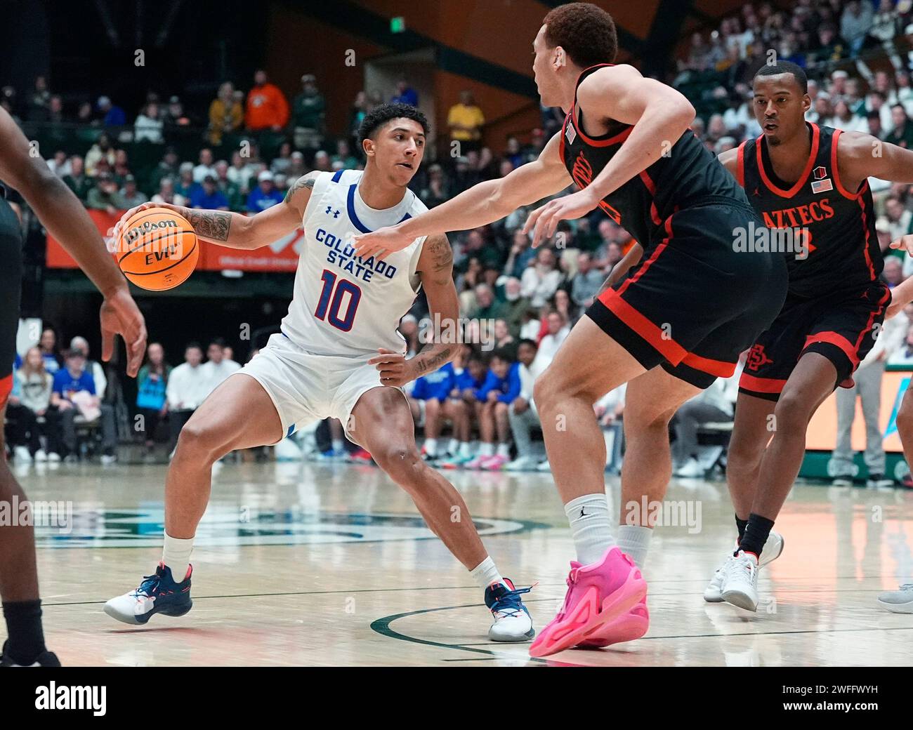 Colorado State guard Nique Clifford, left, looks to drive to the rim ...