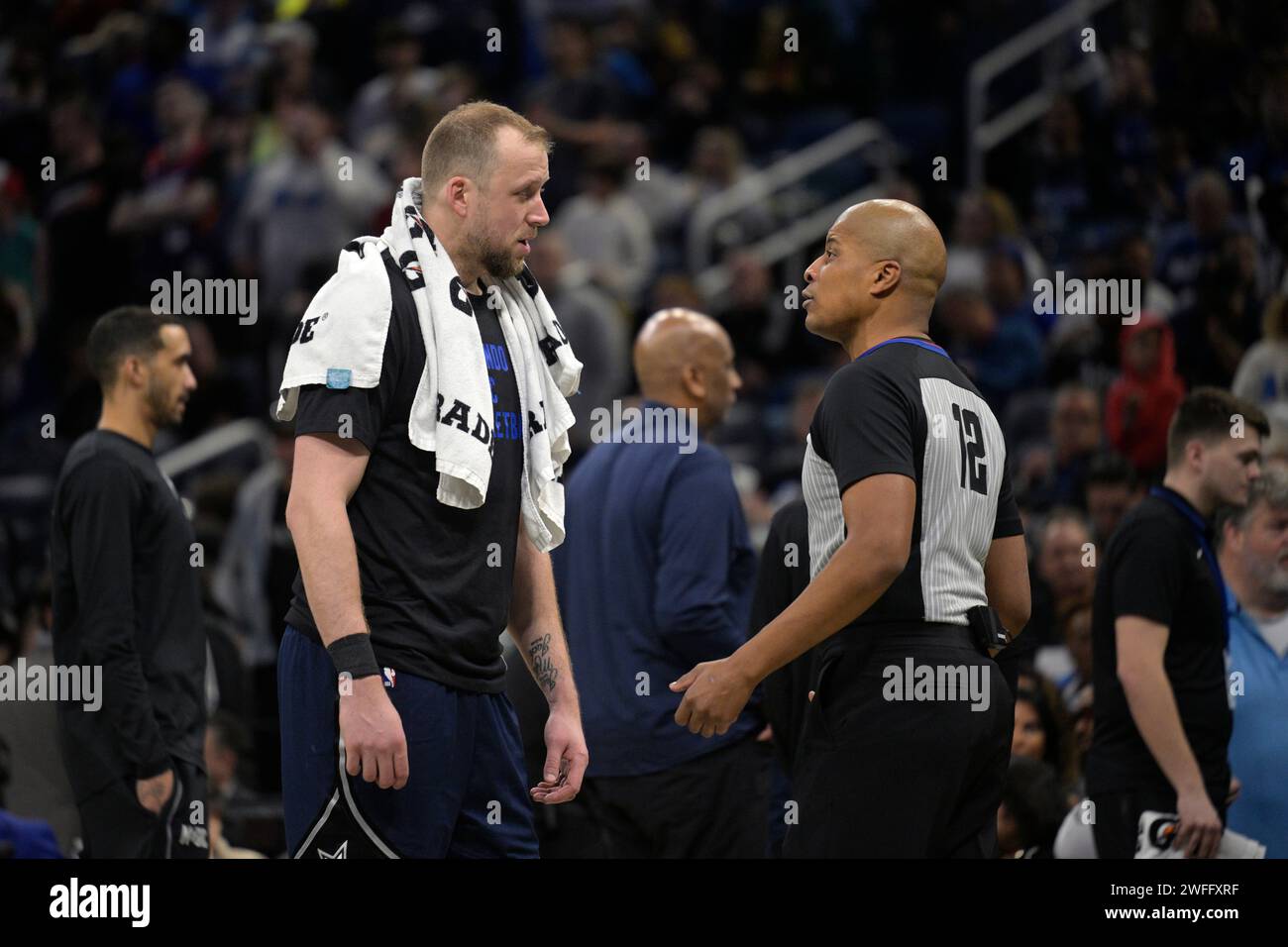 Orlando Magic guard Joe Ingles, left, talks with official CJ Washington ...