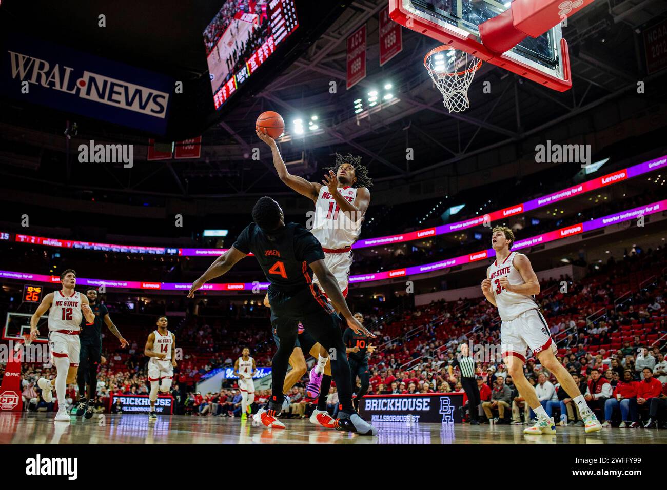 January 30, 2024: NC State Wolfpack guard Dennis Parker Jr. (11) shoots ...
