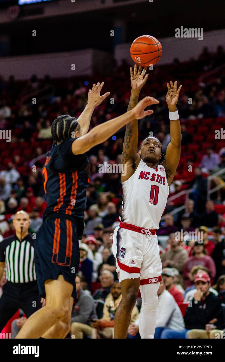 Raleigh, NC, USA. 30th Jan, 2024. NC State Wolfpack guard DJ Horne (0) attempts a three point ...