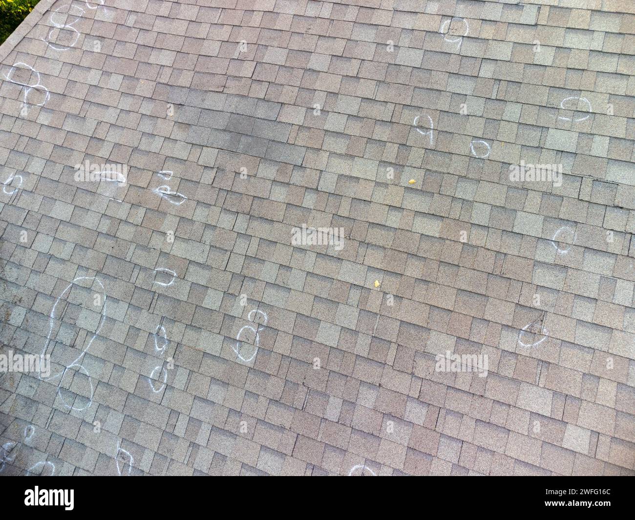 Roo0f with hail damage and chalk markings from inspection Stock Photo ...