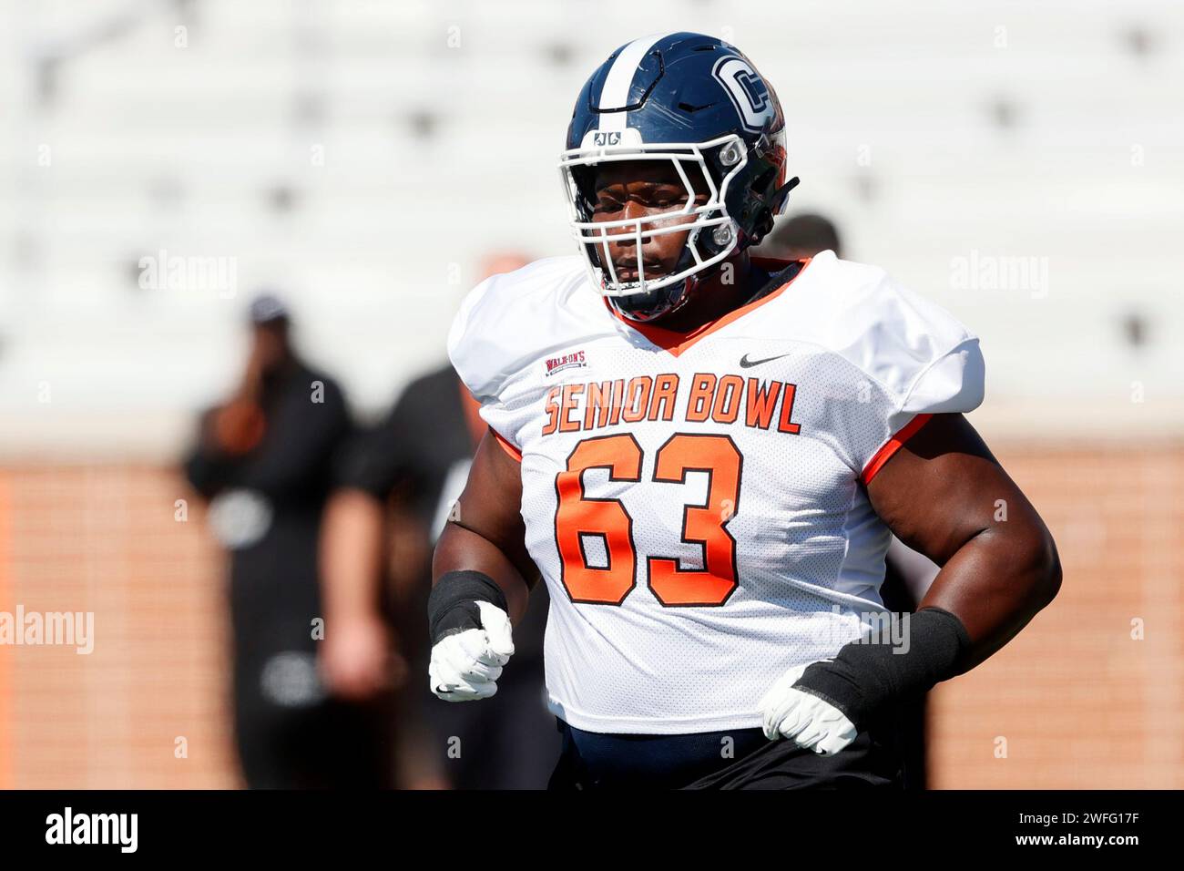 American offensive lineman Christian Haynes of Uconn runs through ...