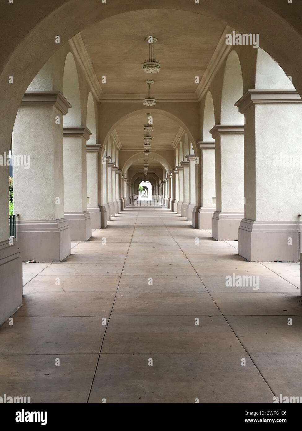 Covered walkway at Balboa Park with columns and arches Stock Photo - Alamy