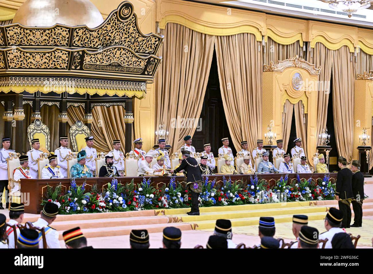 Sultan of Johor, Sultan Ibrahim Iskandar, center, sits during the oath ...