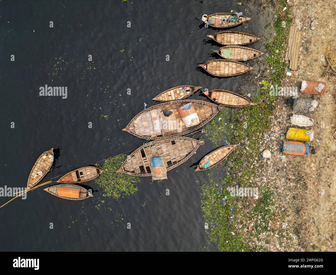 Non Exclusive: January 30, 2024, Dhaka, Bangladesh: Aerial view of wooden passenger boats along ...