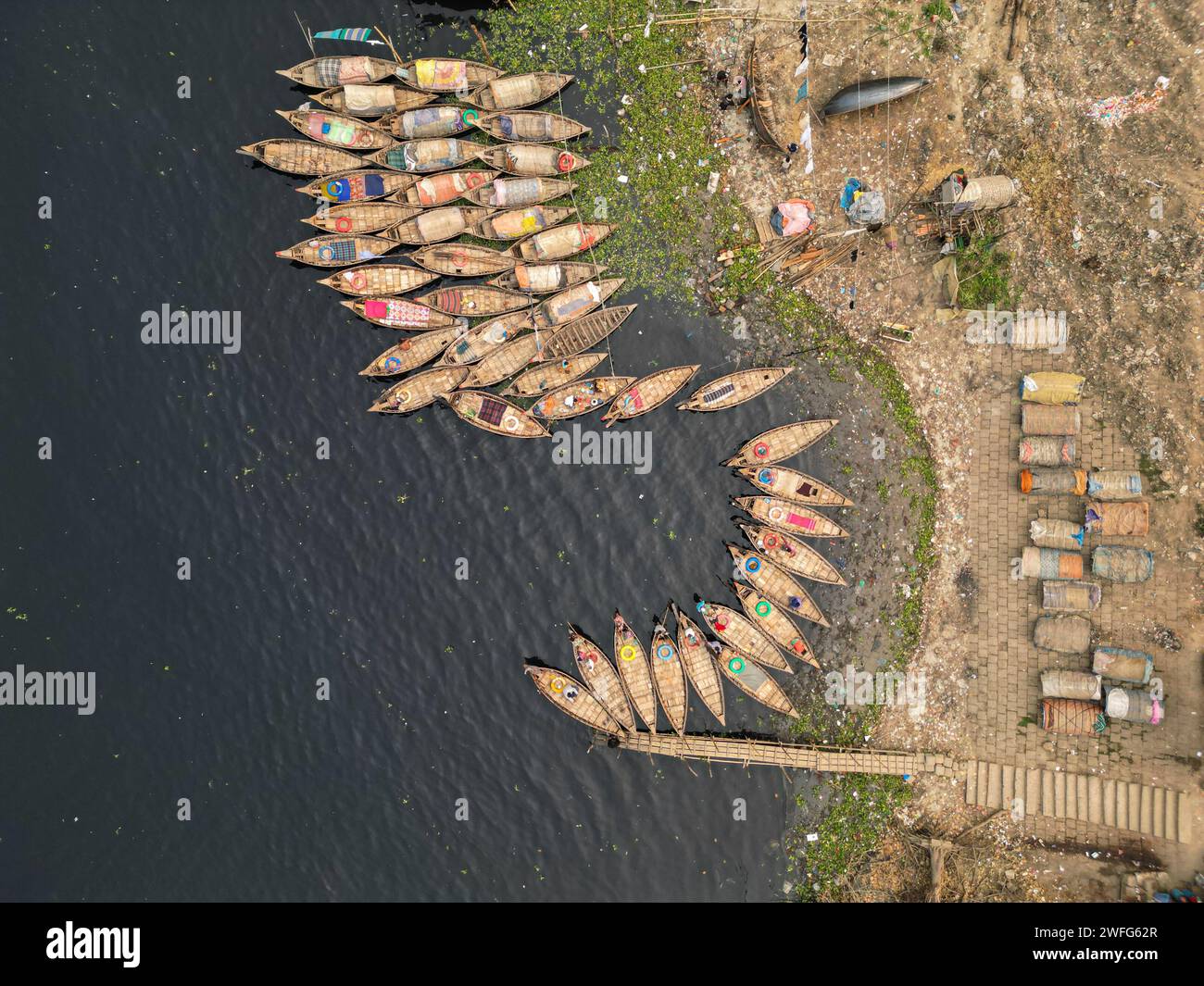 Non Exclusive: January 30, 2024, Dhaka, Bangladesh: Aerial view of wooden passenger boats along ...