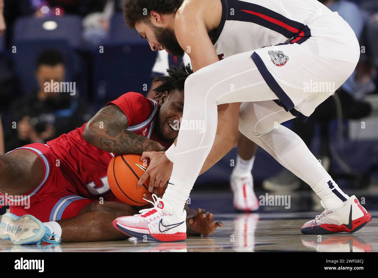 Gonzaga forward Anton Watson, right, and Loyola Marymount guard Justin ...