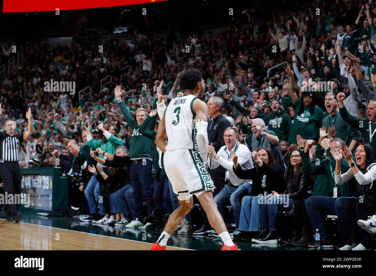 Michigan State guard Jaden Akins (3) celebrates with fans after hitting ...