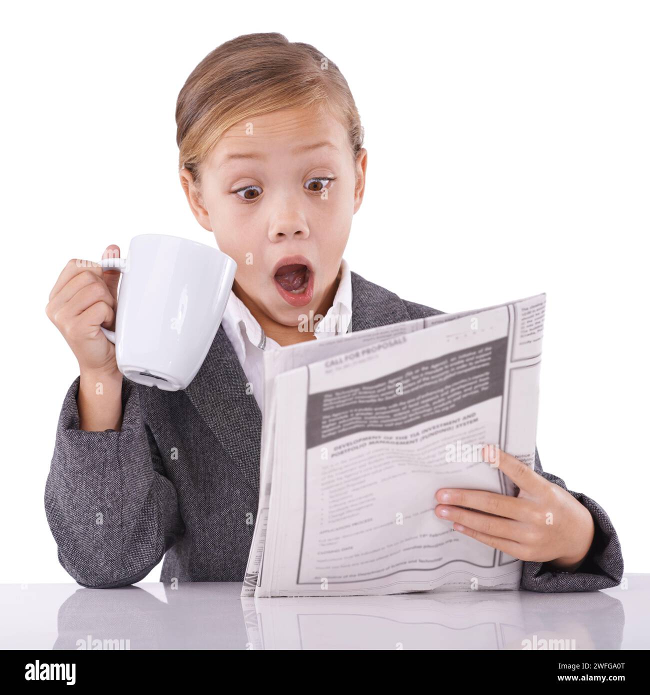 Young child, reading and newspaper headlines in studio with shock for ...
