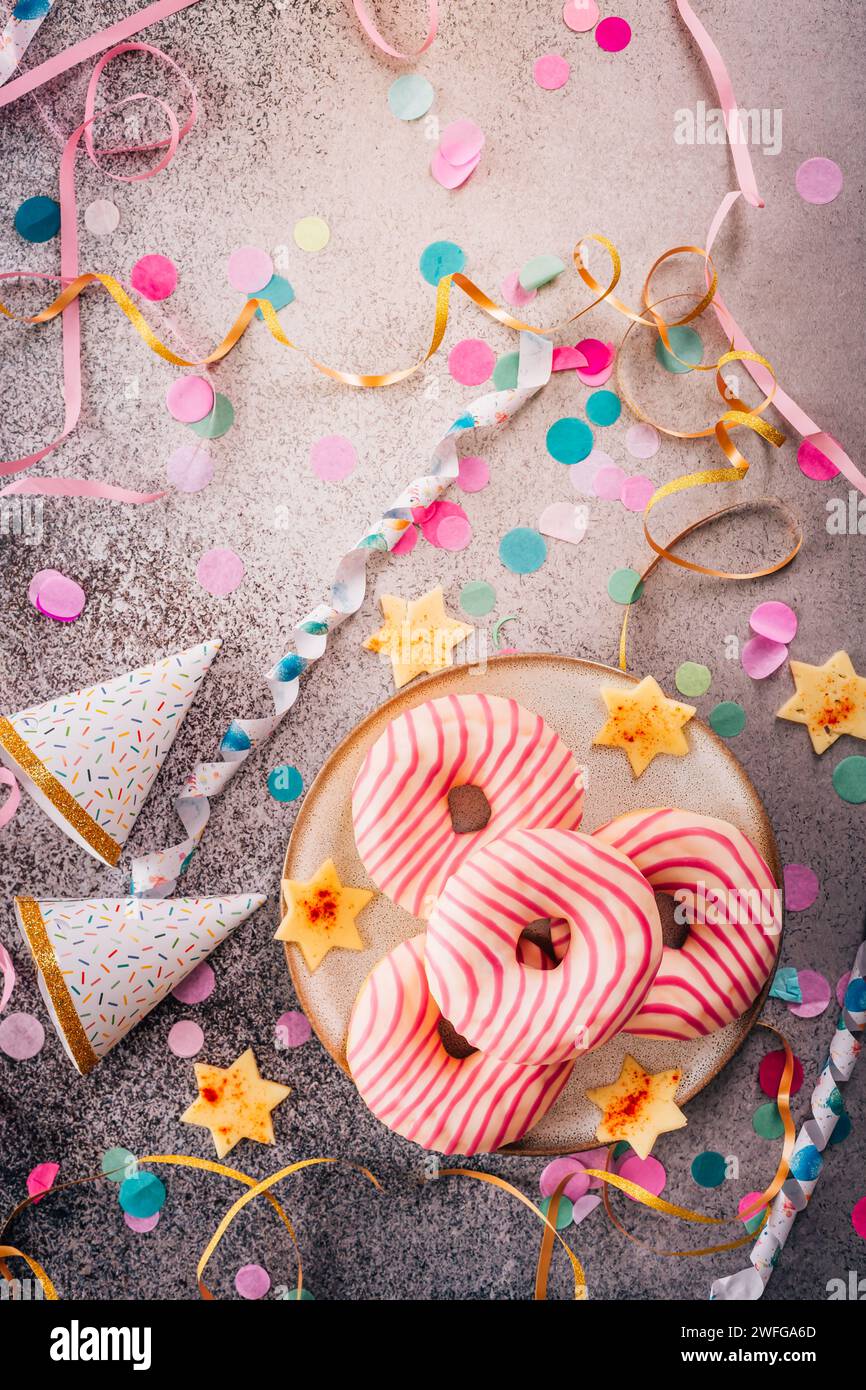 Donuts for carnival and party. German Krapfen or donuts with streamers ...