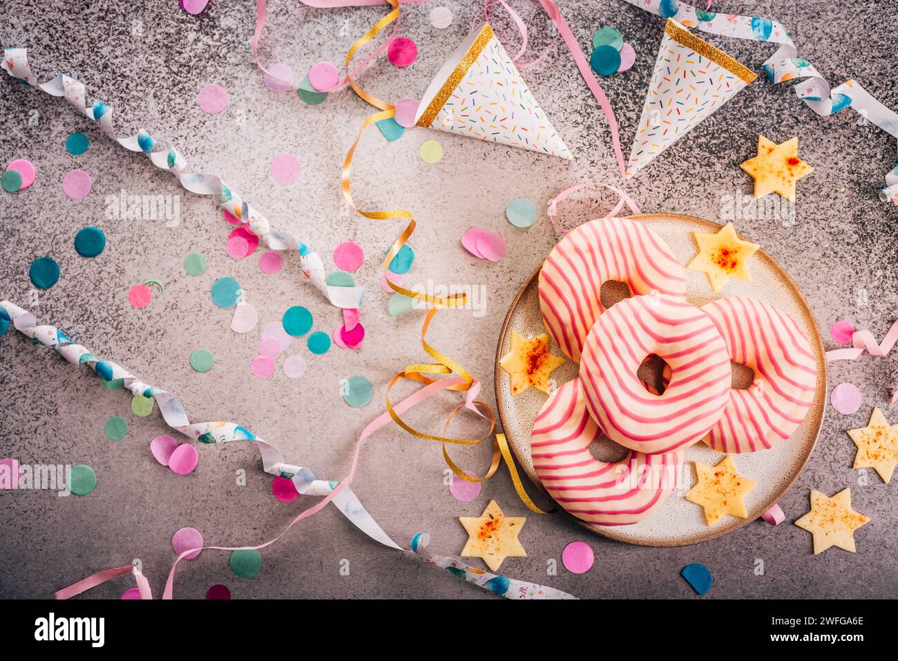 Donuts for carnival and party. German Krapfen or donuts with streamers ...