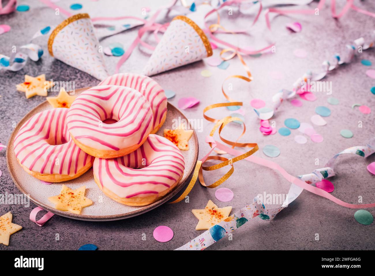 Donuts for carnival and party. German Krapfen or donuts with streamers ...