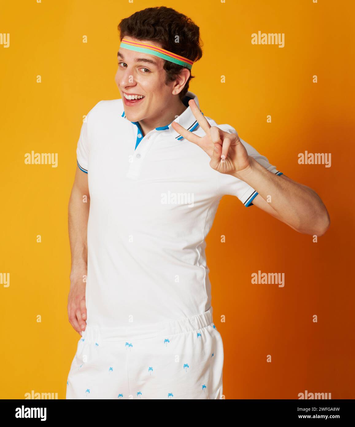 Portrait, tennis and man with peace sign, smile and confident guy on a ...