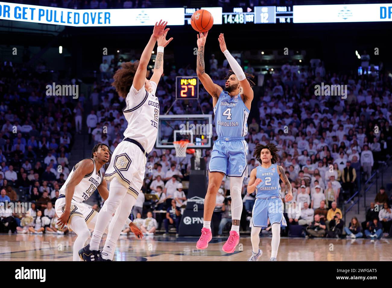 North Carolina guard RJ Davis, right, shoots over Georgia Tech guard ...