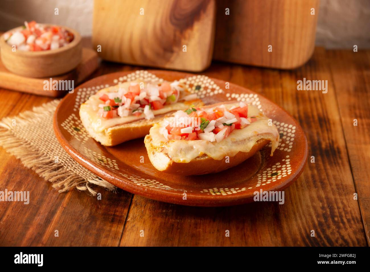Molletes. Mexican recipe based on bolillo bread split lengthwise ...