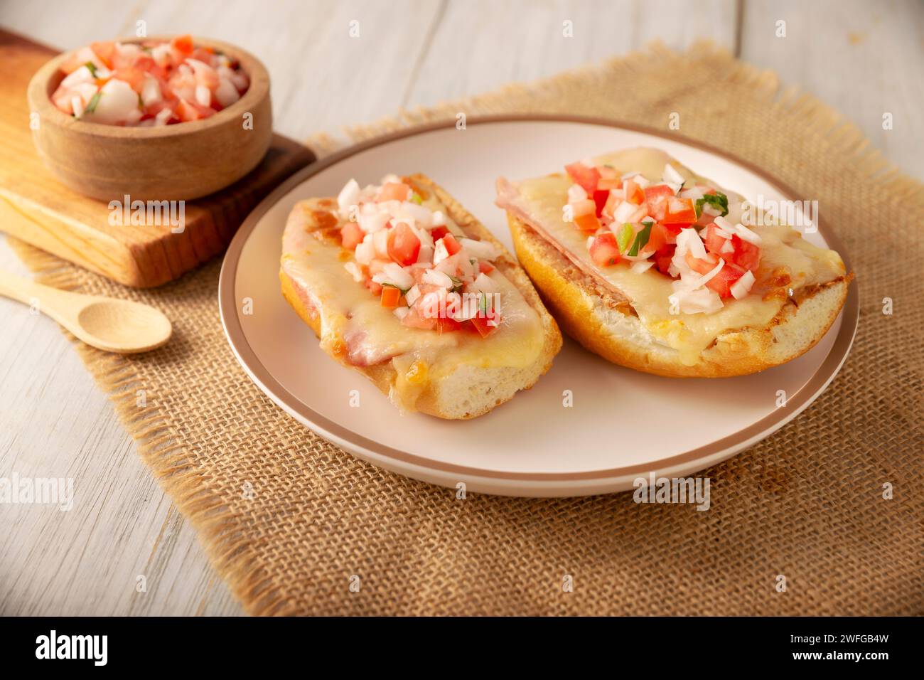 Molletes. Mexican recipe based on bolillo bread split lengthwise ...