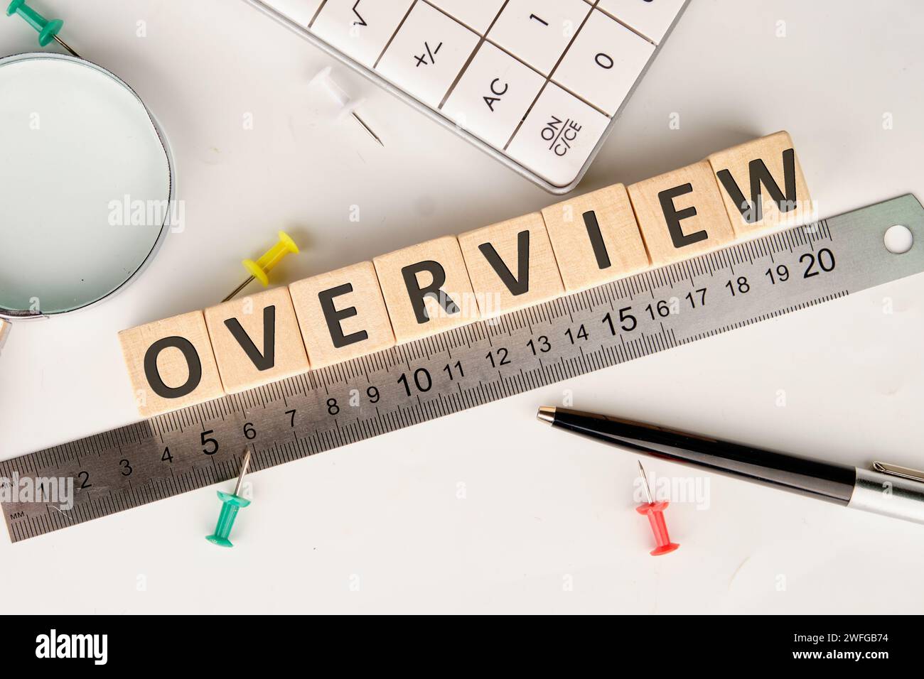 OVERVIEW text of non-wooden cubes next to a calculator, pen, measuring ...
