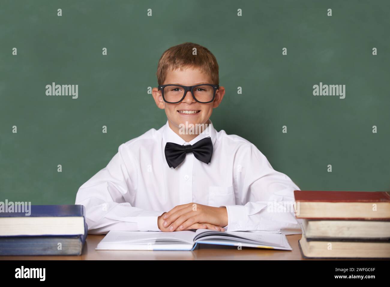 Boy child, books and school in portrait with smile, information and ...